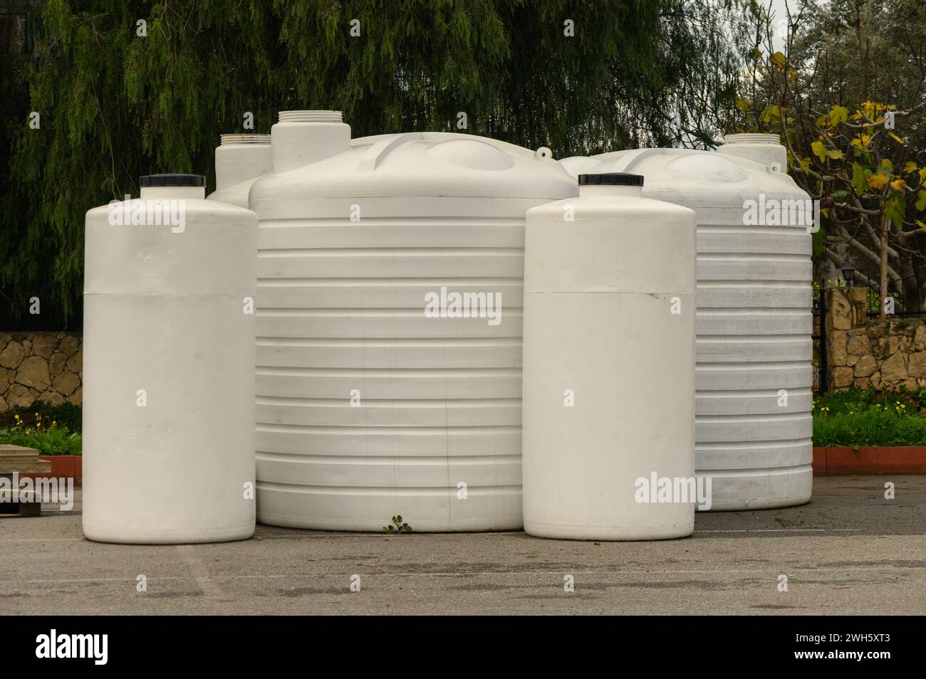 selling water tanks in a village in Cyprus Stock Photo - Alamy