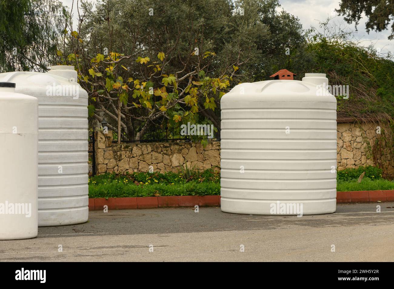 selling water tanks in a village in Cyprus 1 Stock Photo - Alamy