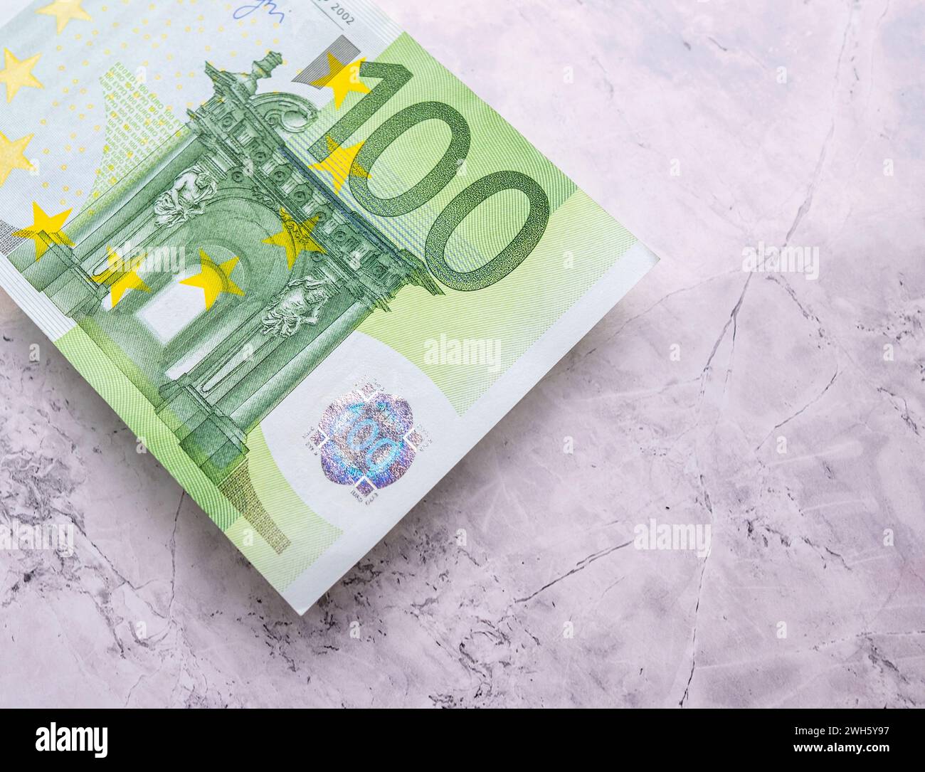 Close-up of 100 Euro banknotes isolated on a background. Close-up high ...