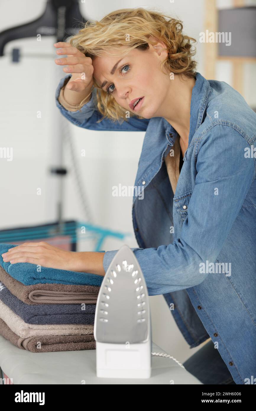 picture of woman sweating from ironing Stock Photo - Alamy