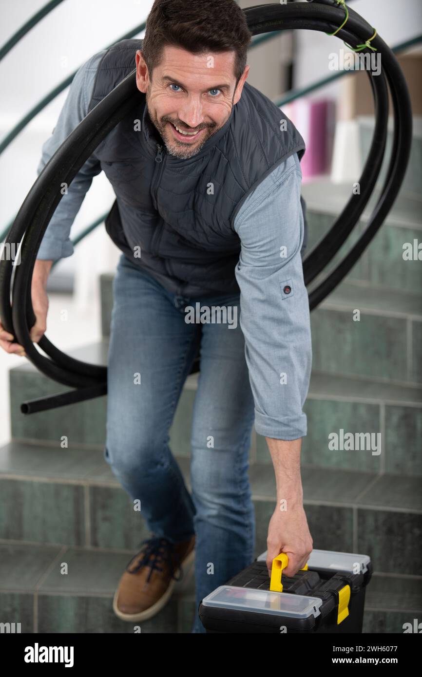 happy male electrician on white background Stock Photo - Alamy