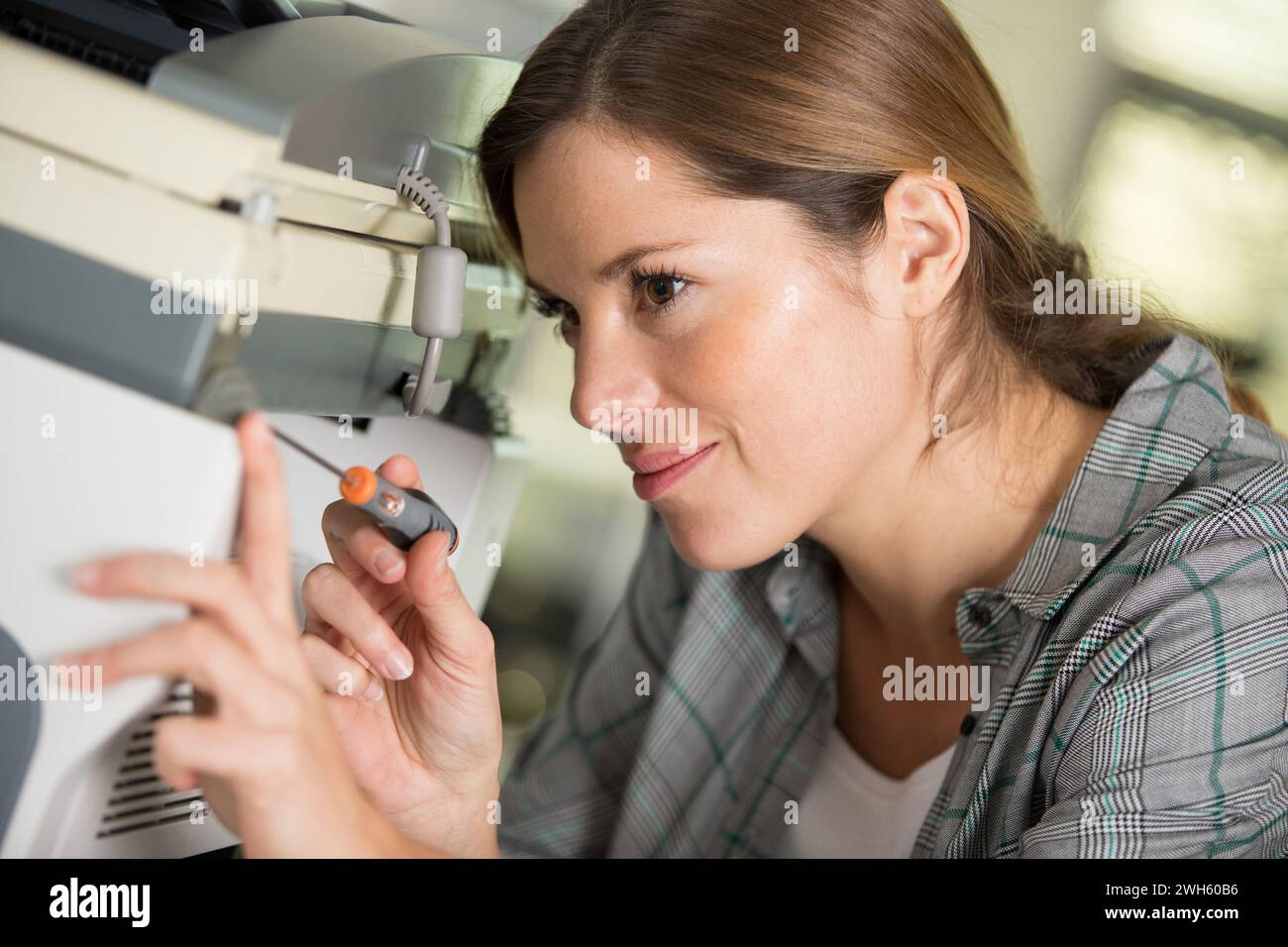Engineer using screwdriver fix upgrade hi-res stock photography and ...