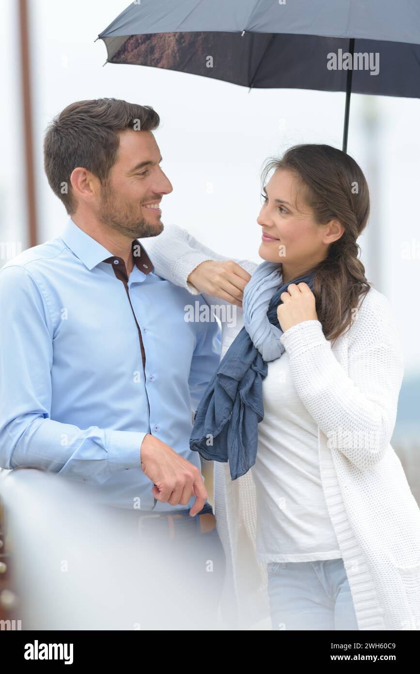 friends under one umbrella in rainy season Stock Photo - Alamy
