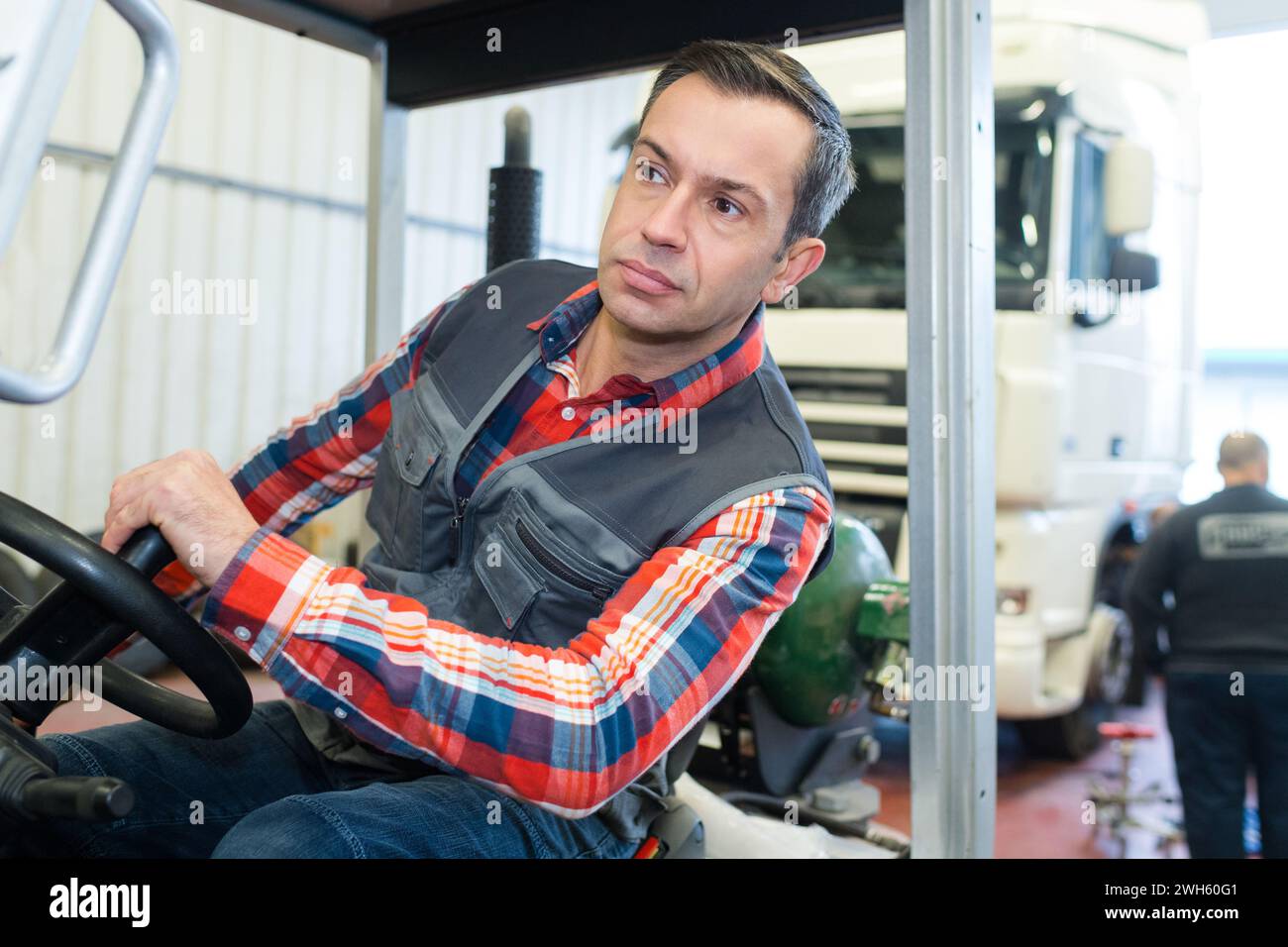heavy equipment mechanic driving Stock Photo - Alamy