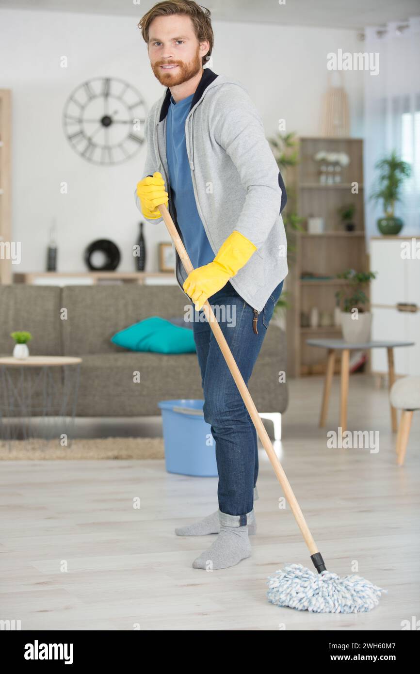 Man mopping floor hi-res stock photography and images - Alamy