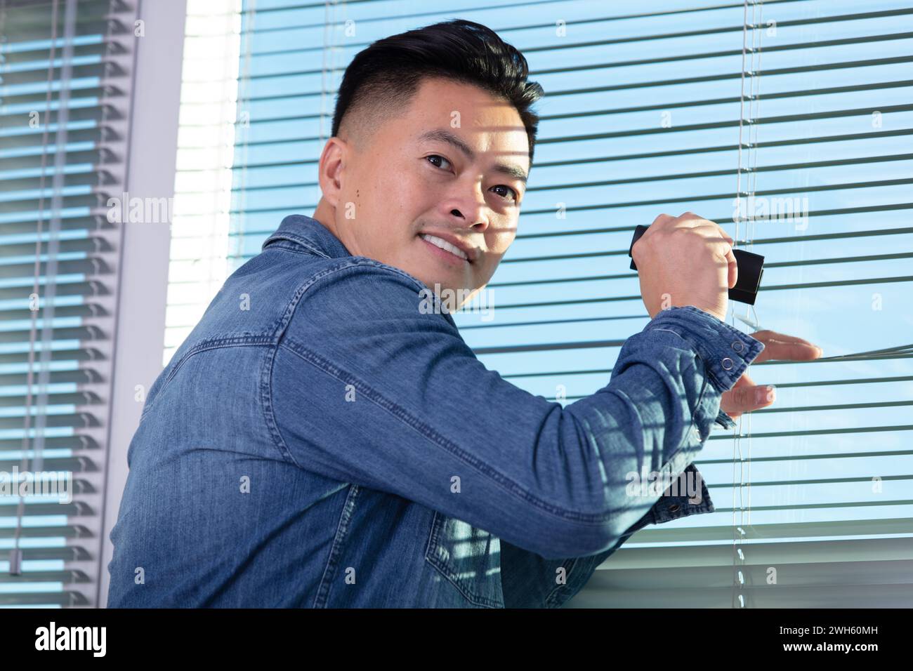 Detective spy looking through binoculars hi-res stock photography and ...