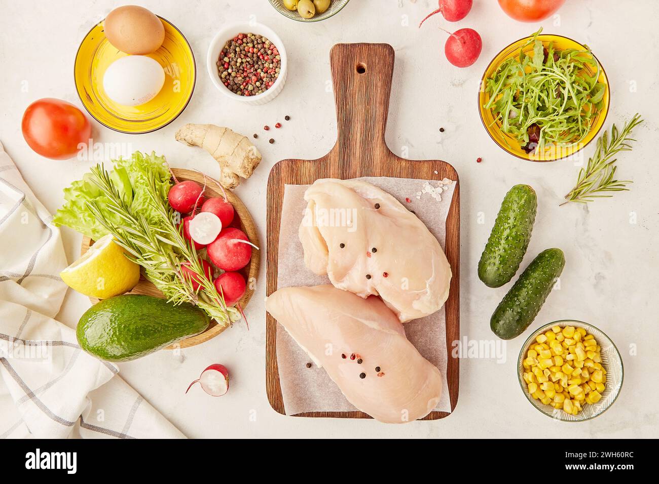 Fresh vegetables, fruits, eggs, chicken fillet, olives and greens. Keto ...