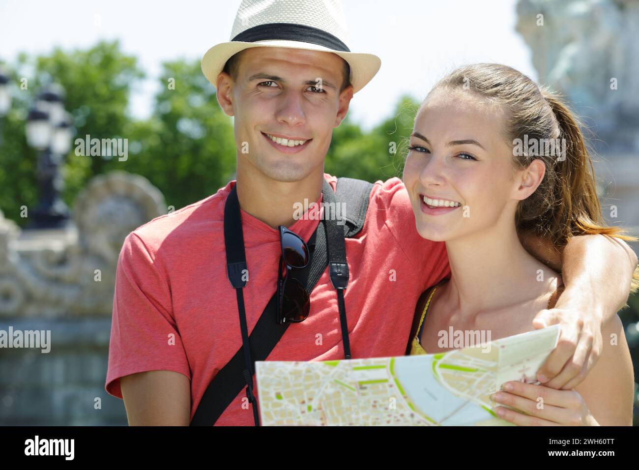 a young couple holding map Stock Photo - Alamy