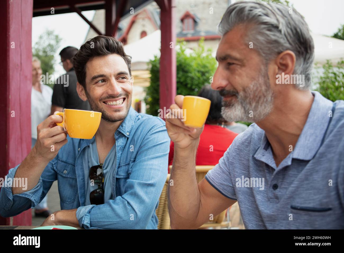 two men cheers toast drink coffe Stock Photo - Alamy