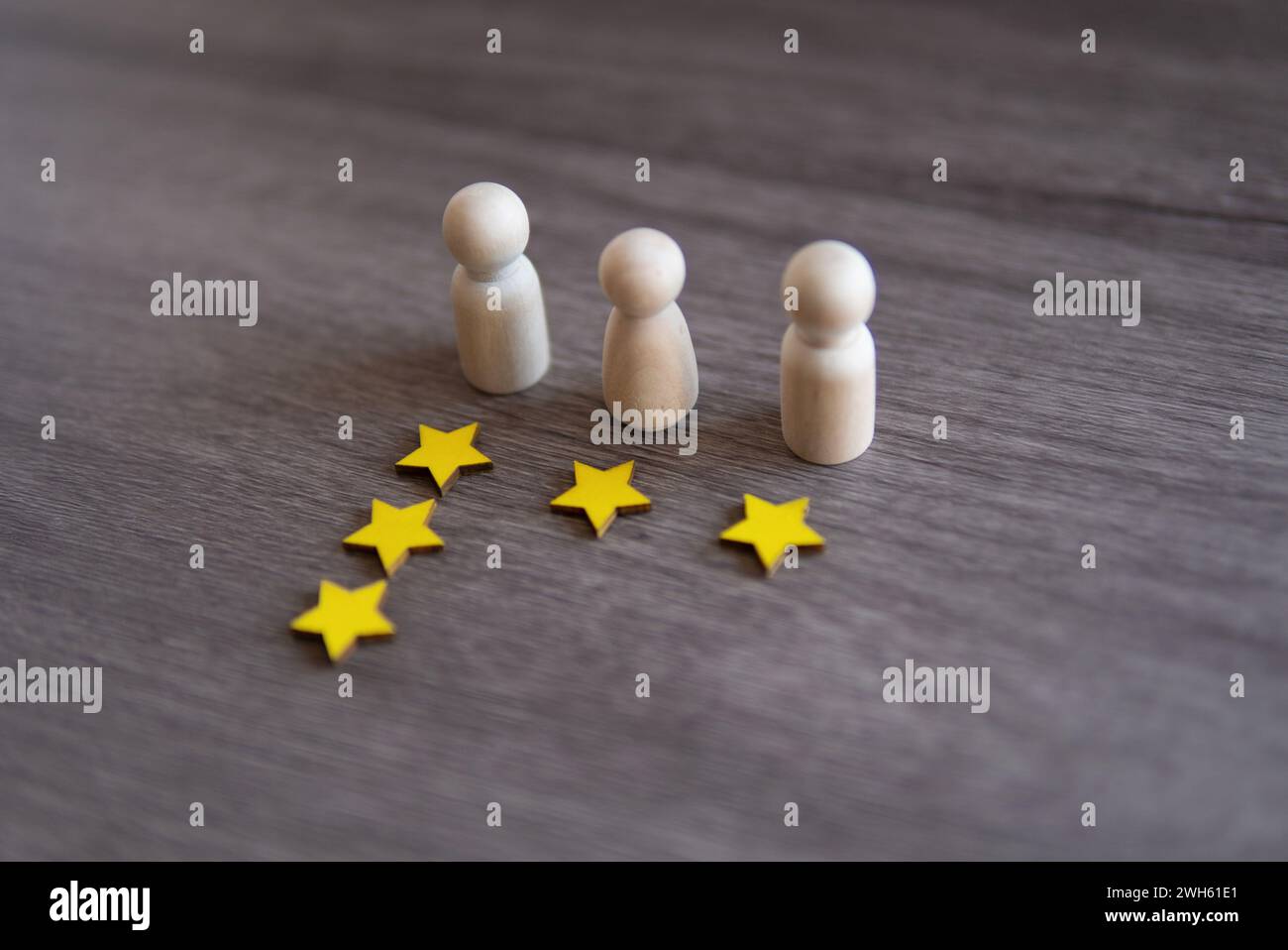 Wooden dolls and stars. Employee recognition, evaluation, and ...