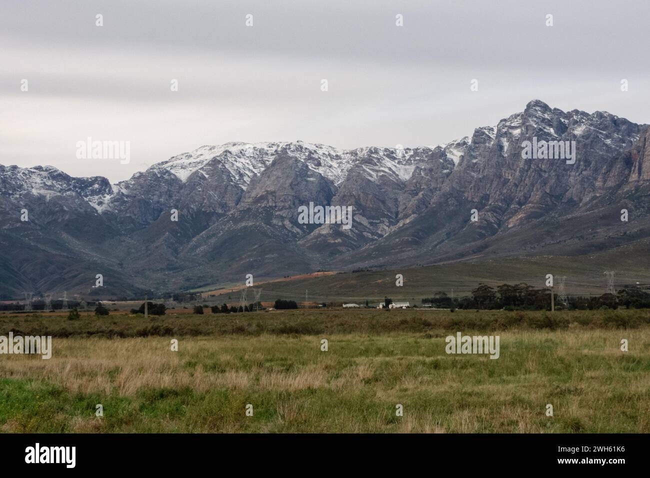 The snow-capped peaks of Breede Valley's distant mountains on a chilly ...