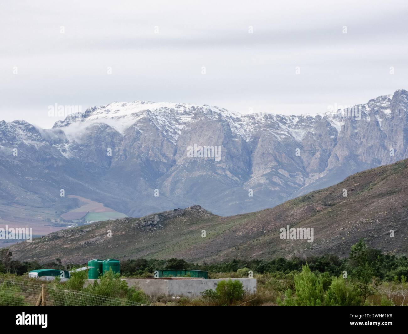 The snow-capped peaks of Breede Valley's distant mountains on a chilly ...