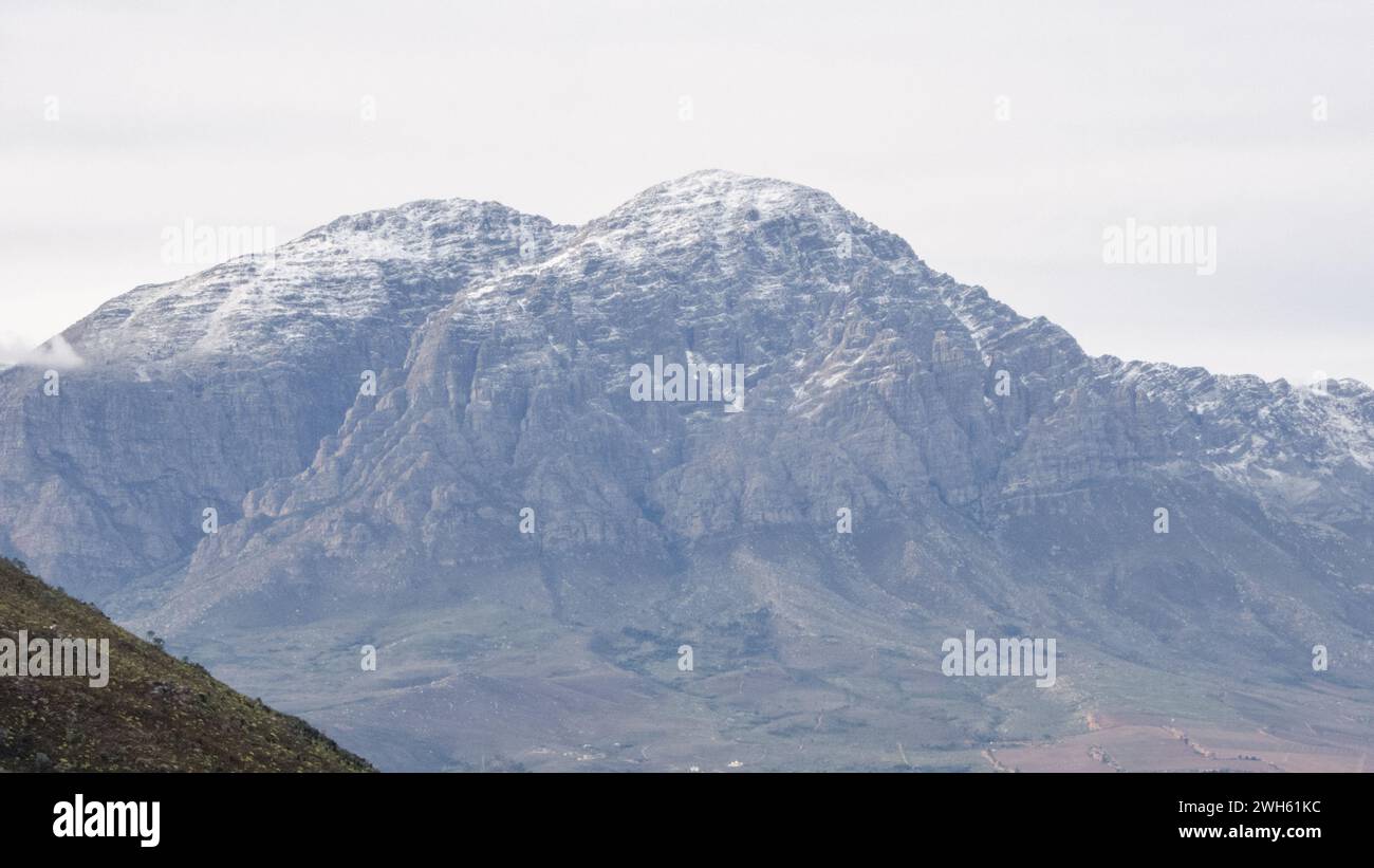 The snow-capped peaks of Breede Valley's distant mountains on a chilly ...