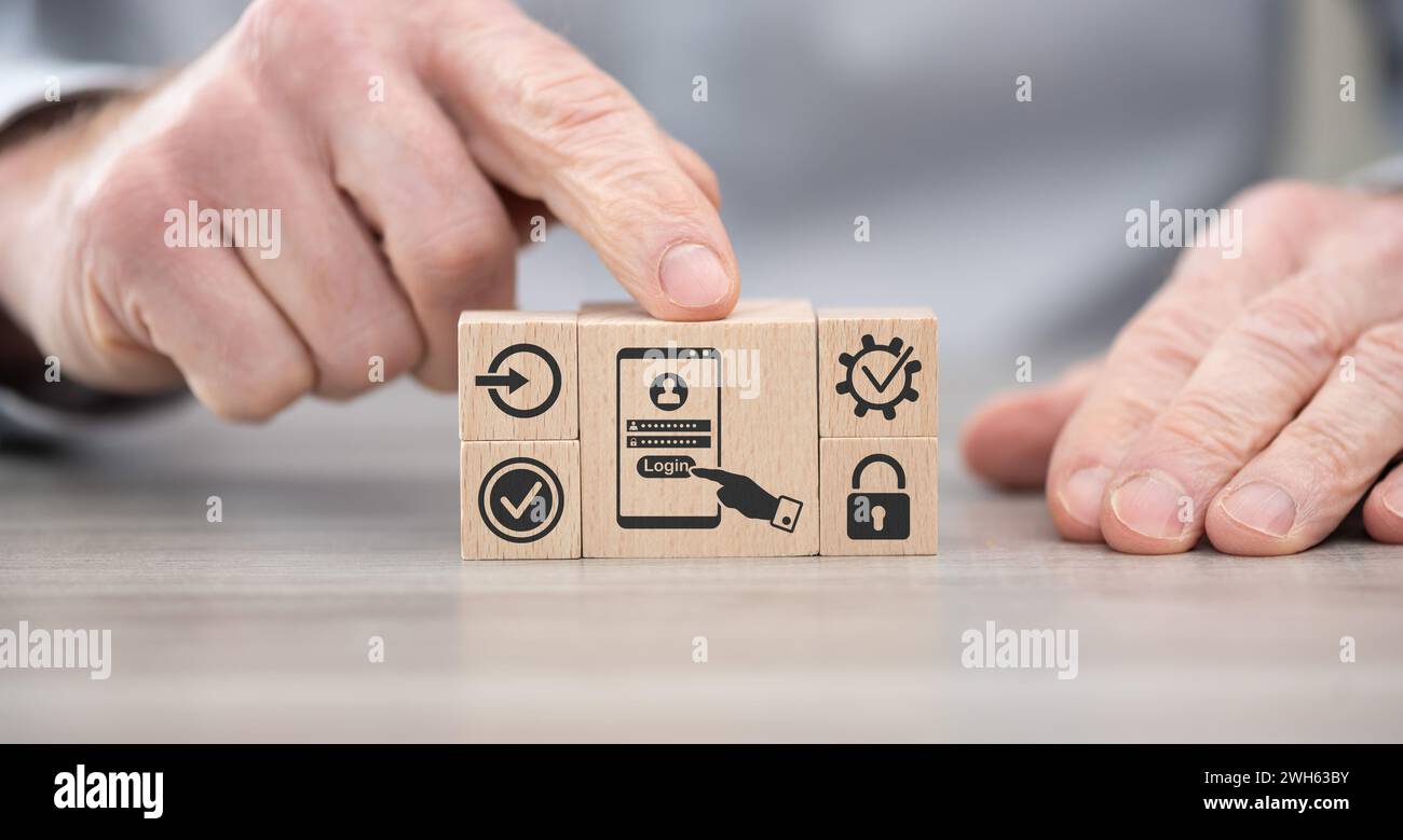 Wooden blocks with symbol of login concept Stock Photo - Alamy