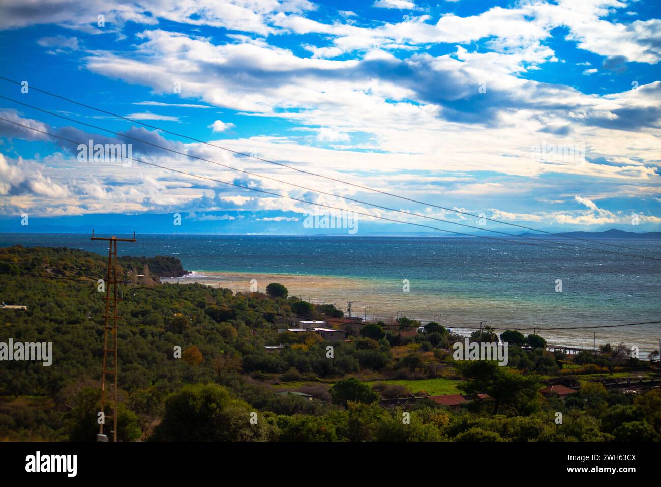 A serene coastal town, where charming houses line the beach and a ...