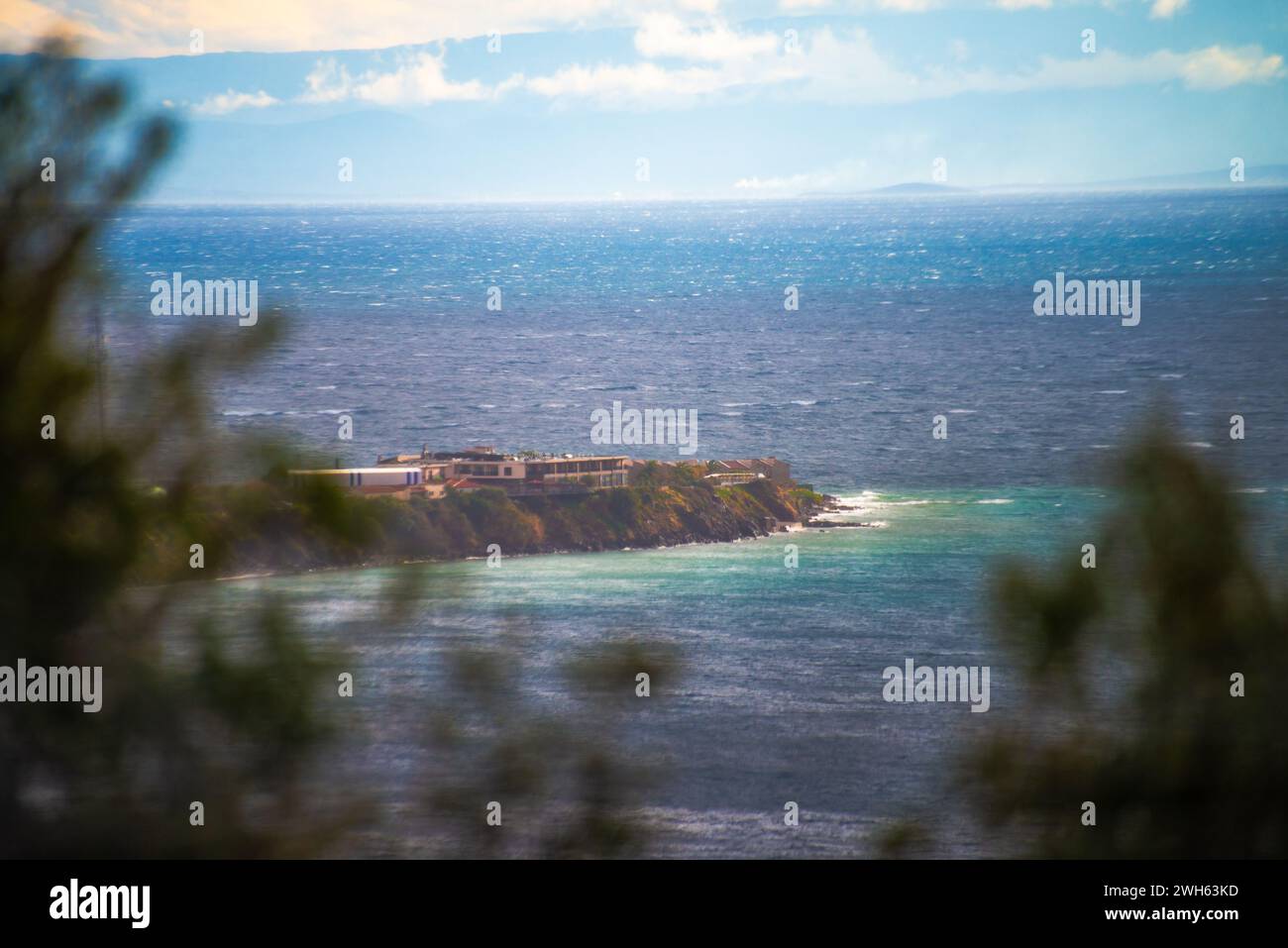 A serene view of a coastal peninsula, where land meets the sea ...