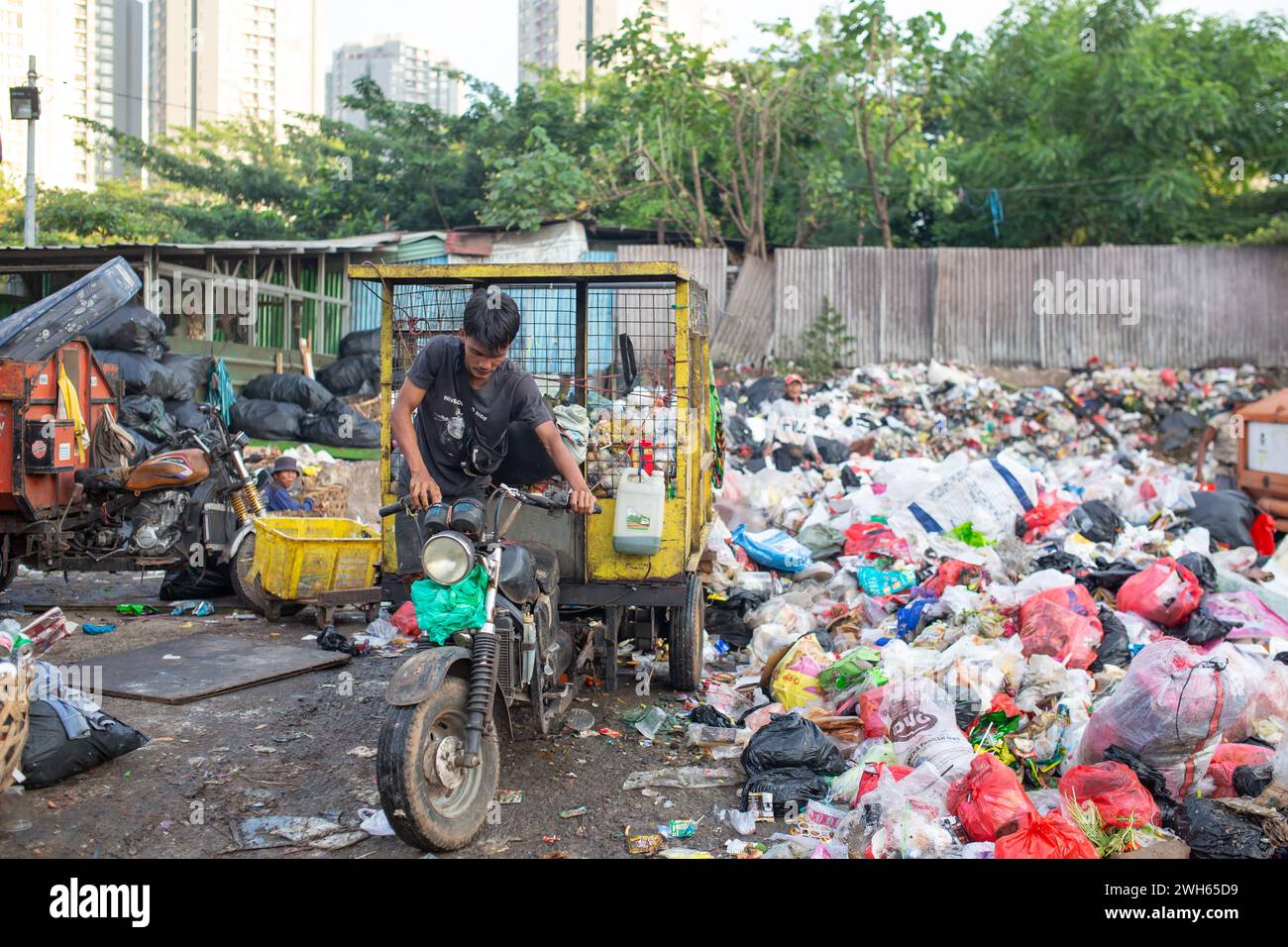 Jakarta, Indonesia - February 8, 2024: An unidentified man working at ...