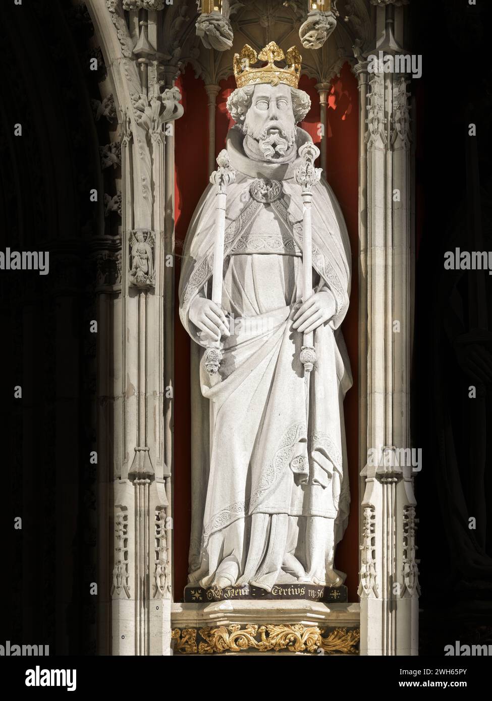 Statue of a medieval english king, Henry III, on the rood screen in the ...
