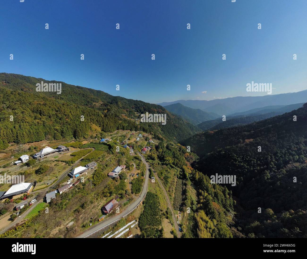 Aerial view of houses and undulating hills in Tokushima Prefecture ...