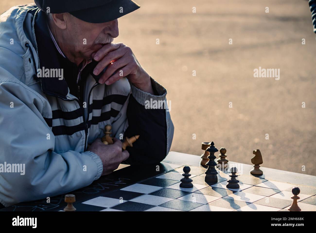 Grandpa playing chess board game hi-res stock photography and images ...