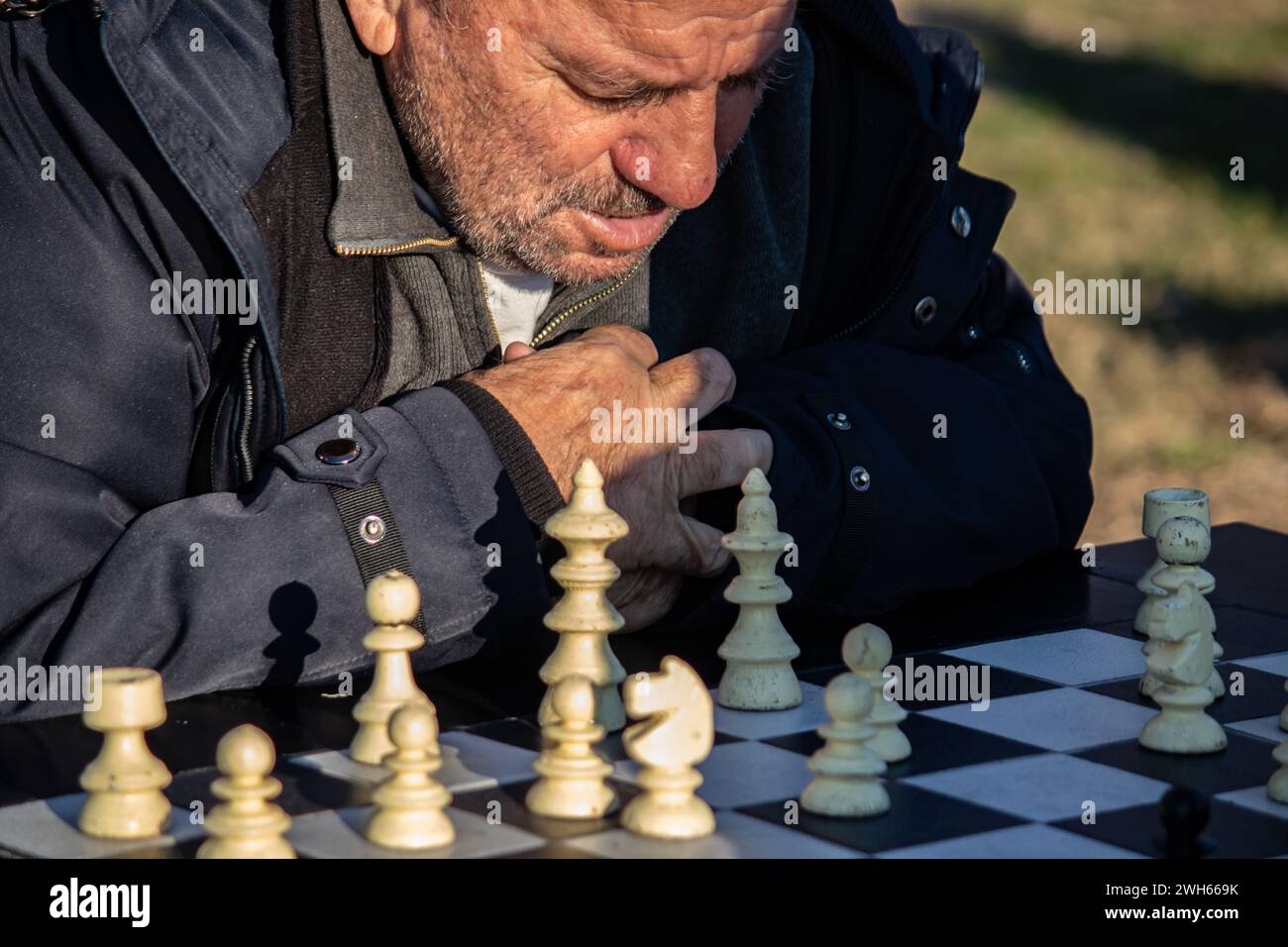 Grandpa playing chess board game hi-res stock photography and images ...