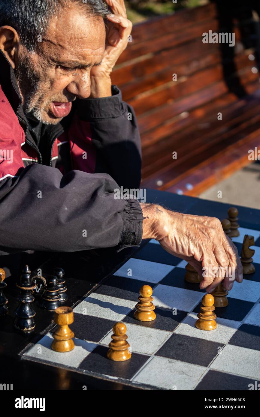 Grandpa playing chess board game hi-res stock photography and images ...