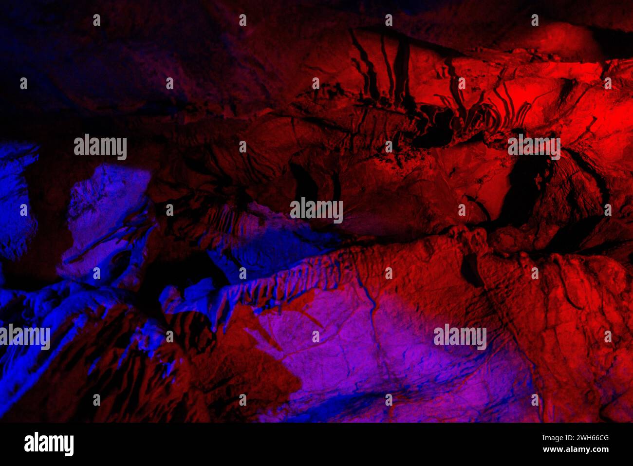 Journey through a vibrant cave adorned with colorful walls, stalactites ...