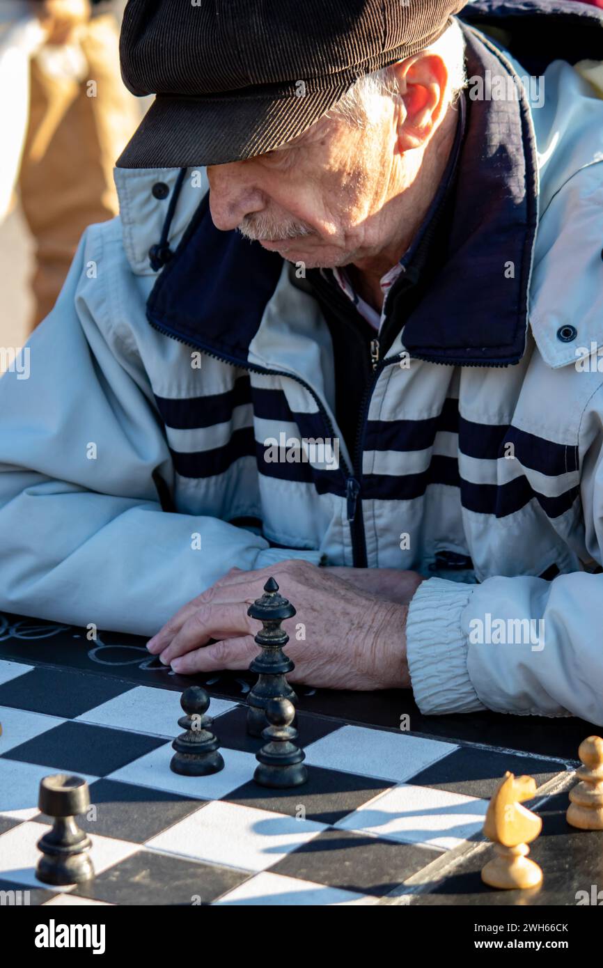 Grandpa playing chess board game hi-res stock photography and images ...