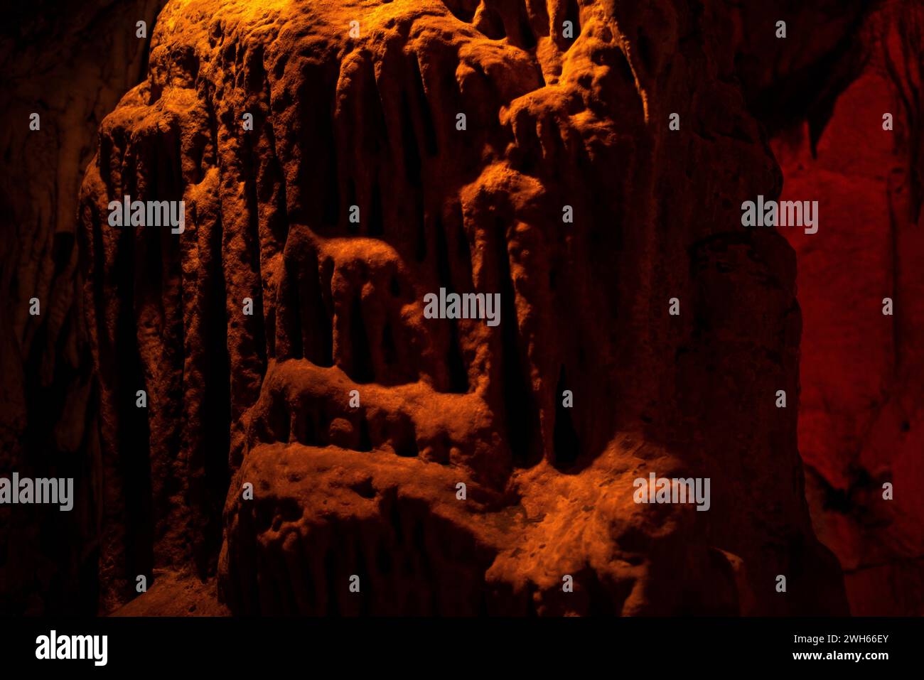 Journey through a vibrant cave adorned with colorful walls, stalactites ...