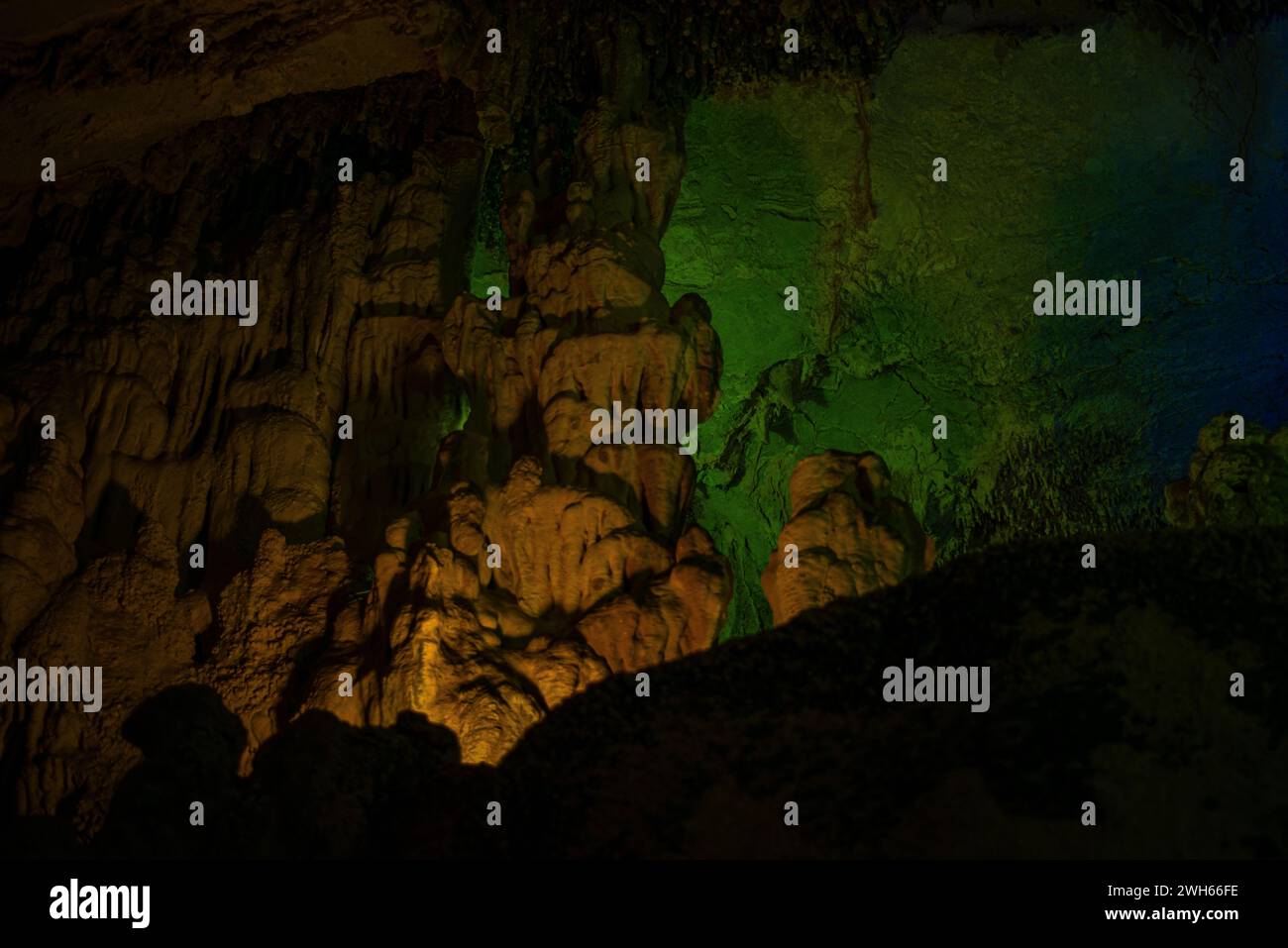 Journey through a vibrant cave adorned with colorful walls, stalactites ...