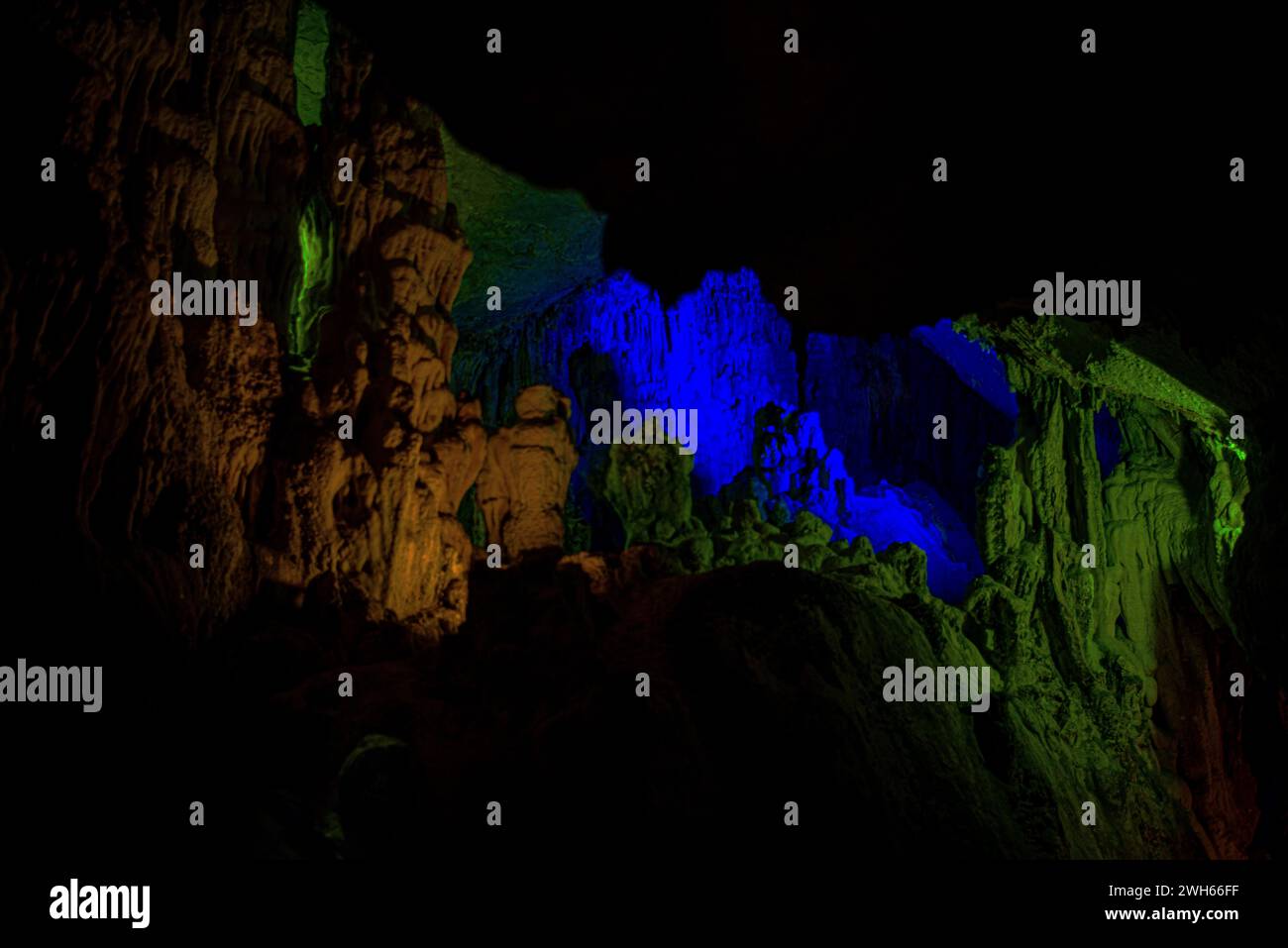 Journey through a vibrant cave adorned with colorful walls, stalactites ...