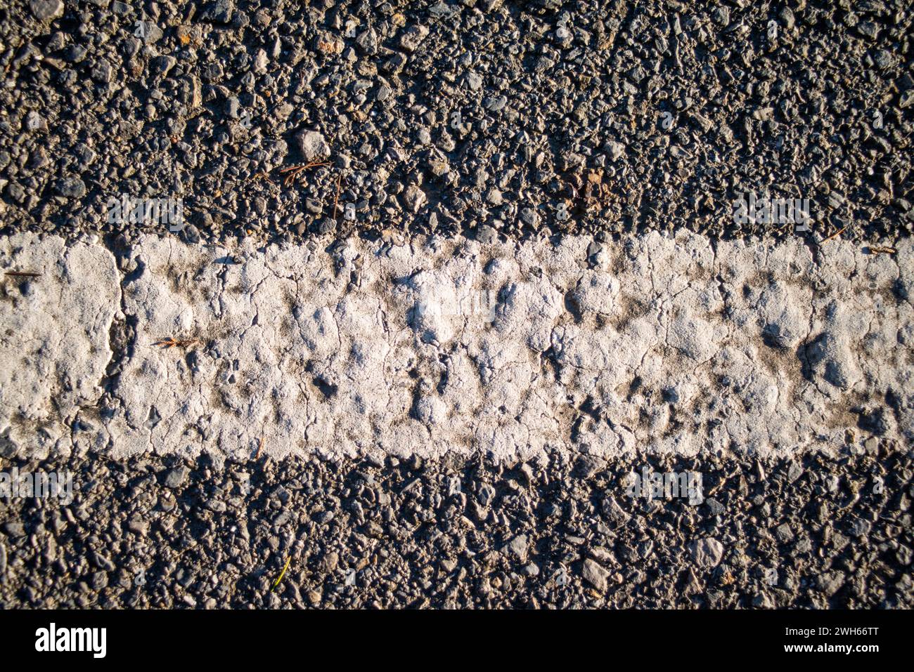 An artistic background featuring asphalt with road markings, blending ...