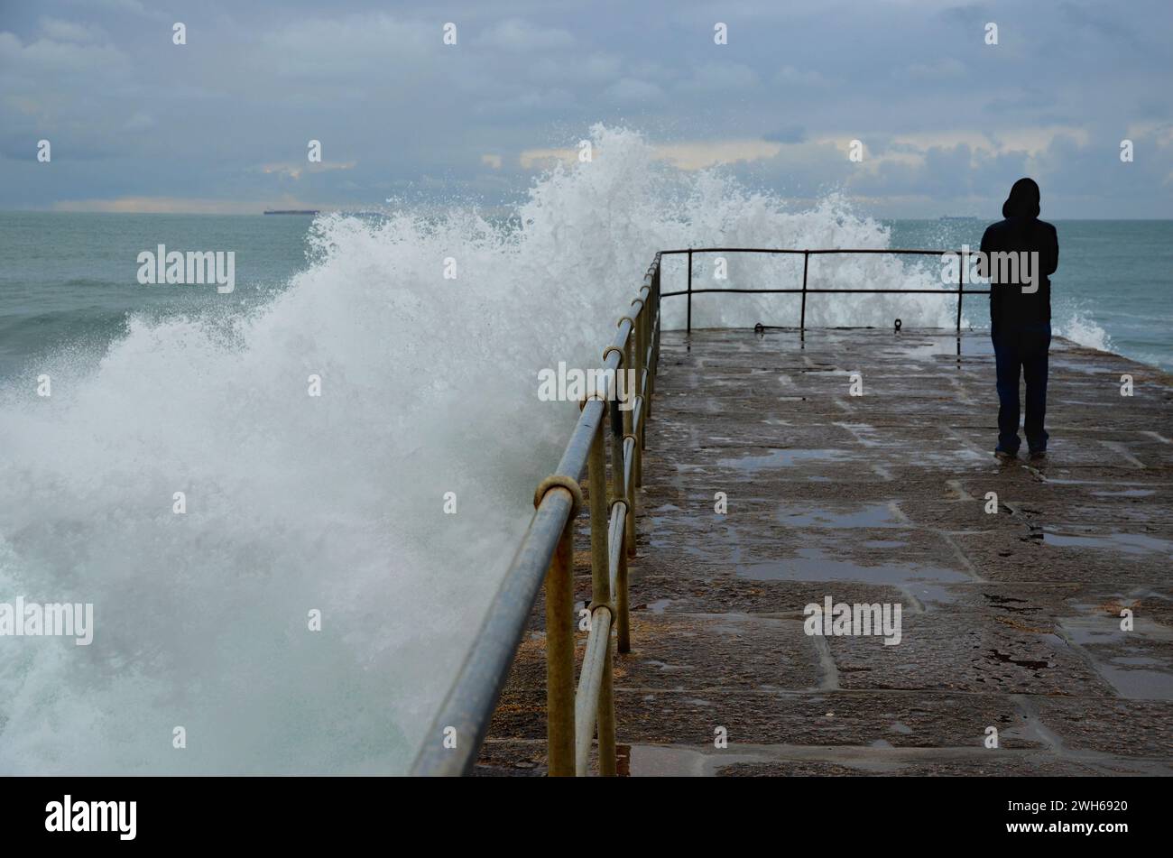 Man standing in ocean waves hi-res stock photography and images - Alamy