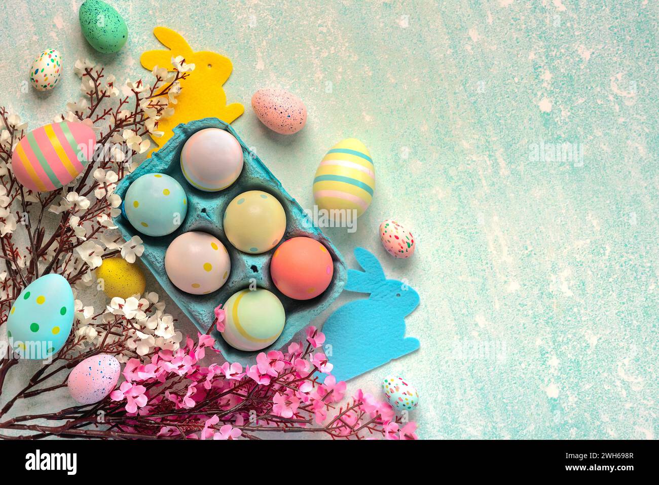 Happy Easter.Top view of easter painted eggs in an blue cardboard box ...