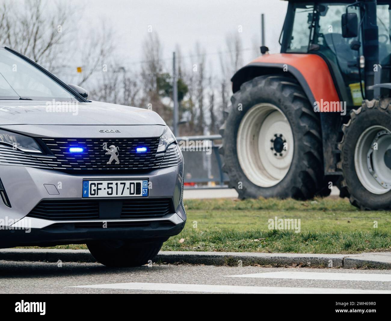 Strasbourg, France - Feb 6, 2024: Police car with beacon as protesters ...