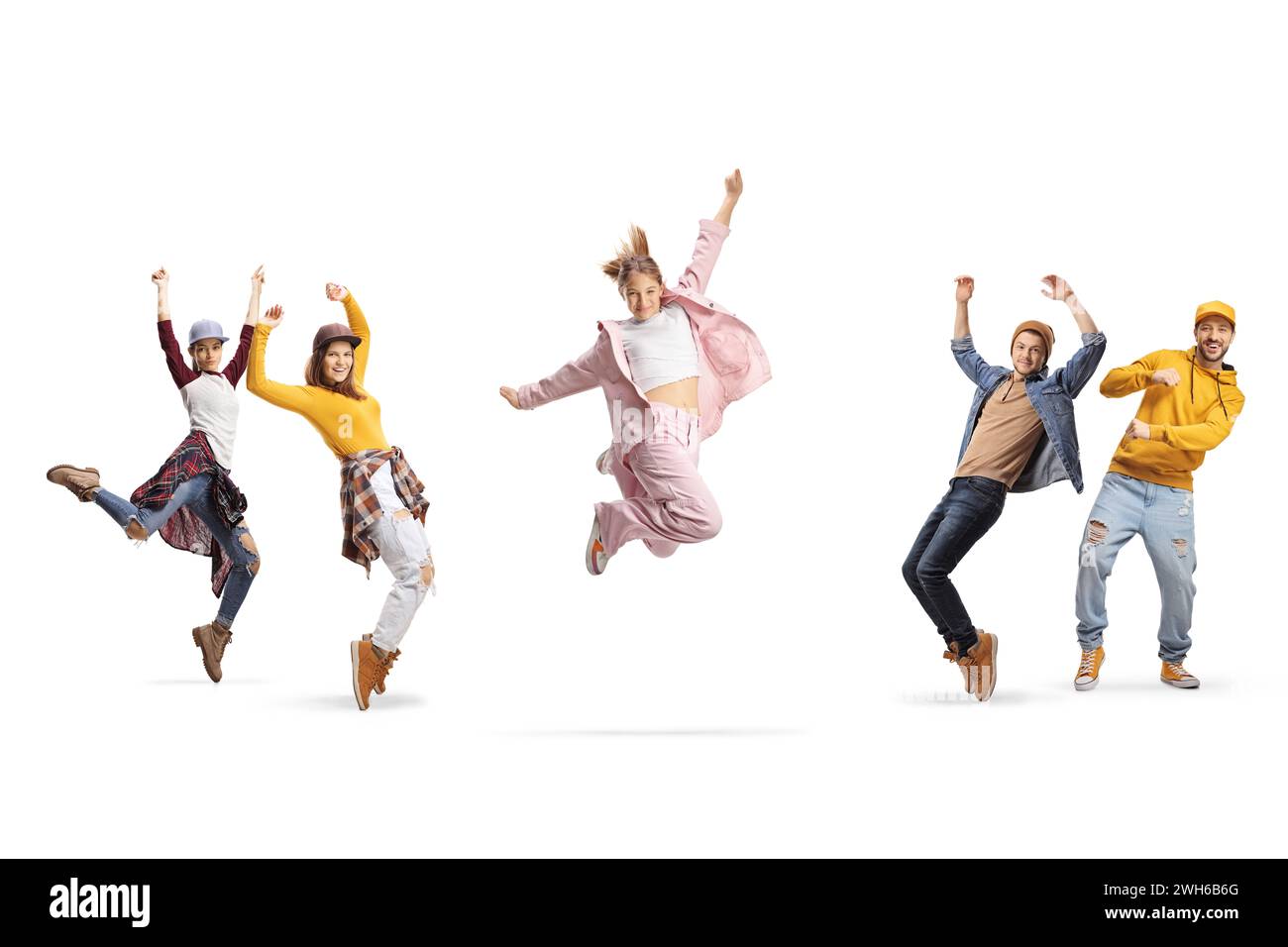 Young happy female jumping between people dancing isolated on white ...