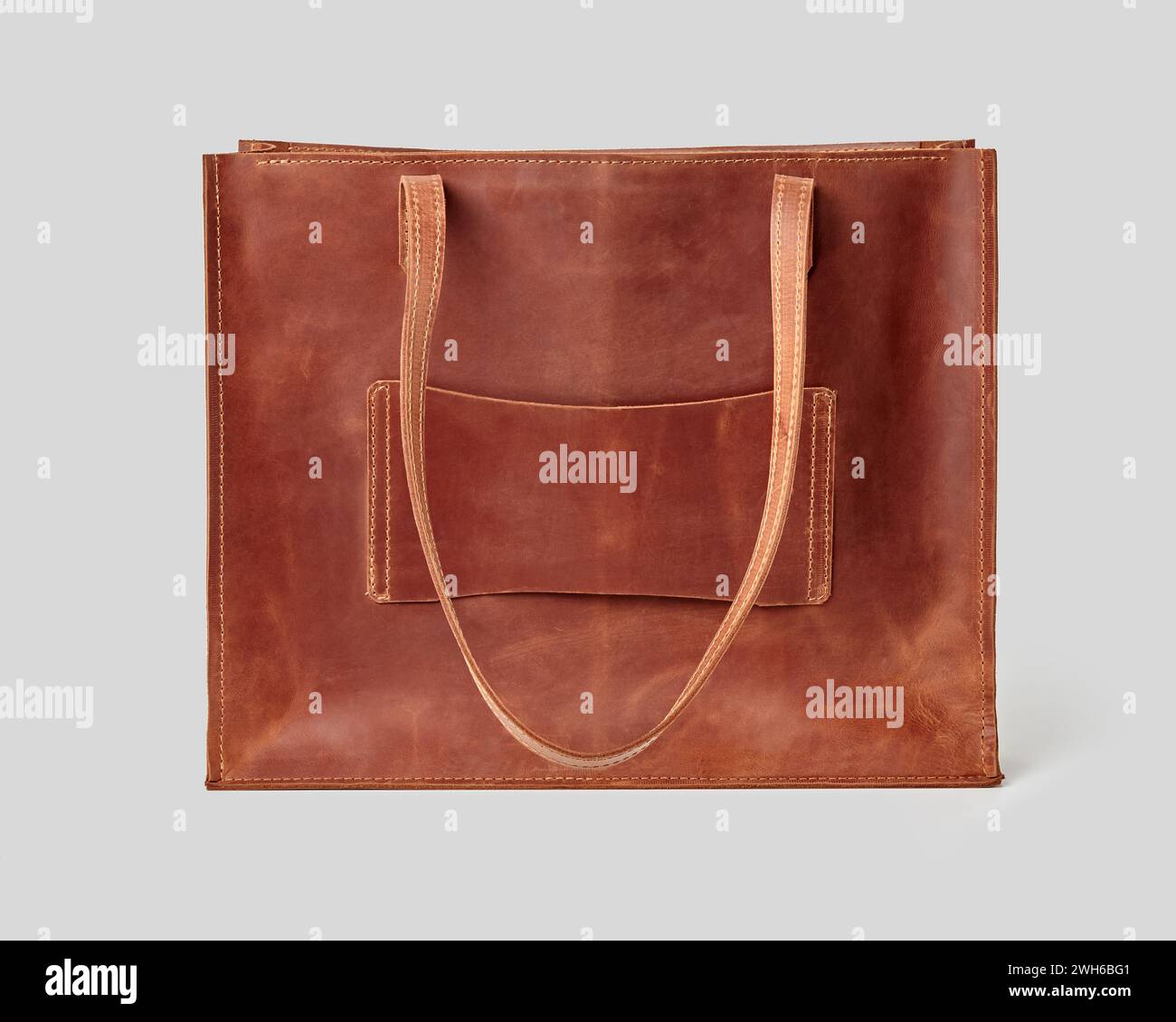 Classic brown leather tote bag with long handles Stock Photo - Alamy