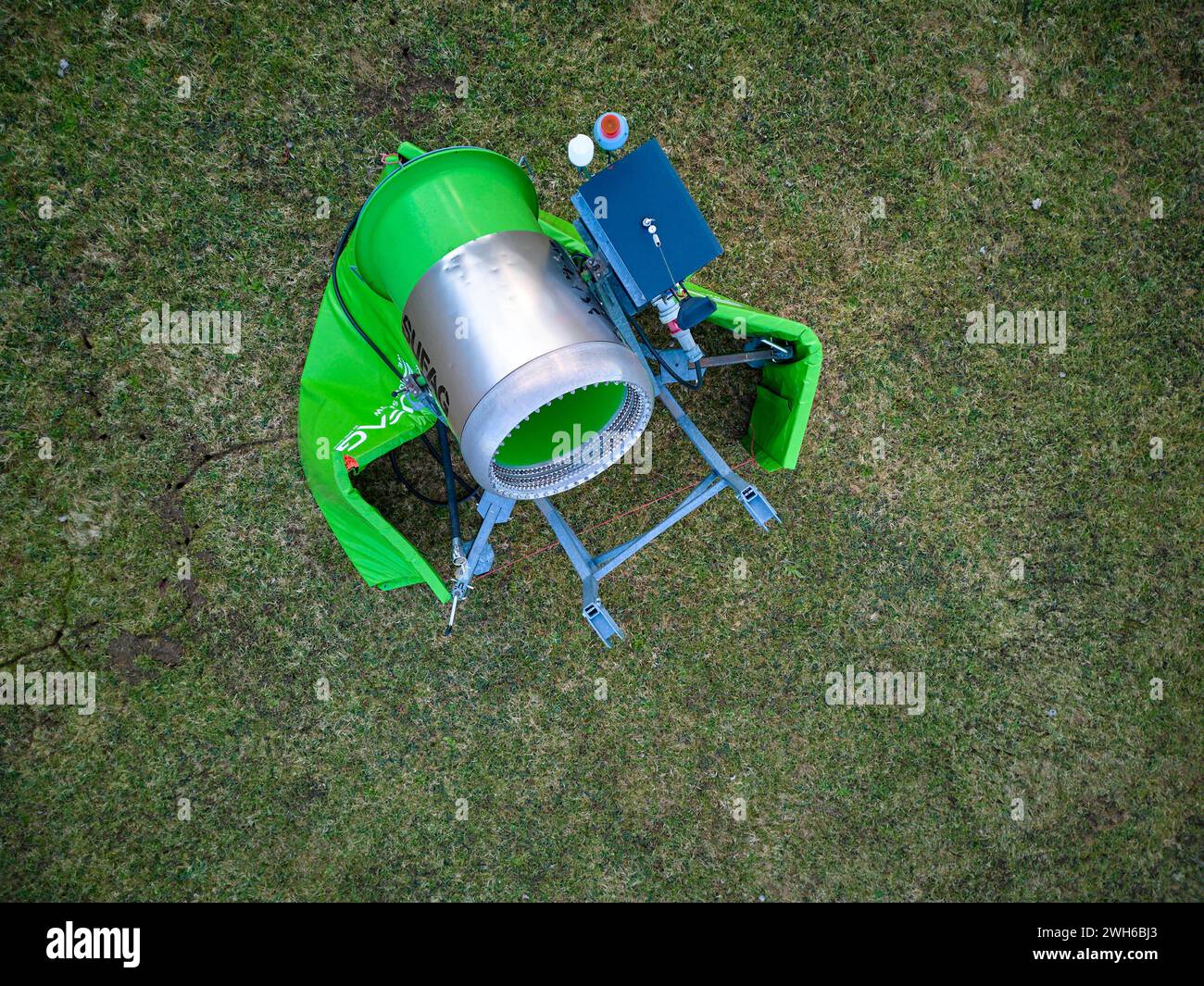 Alpine skiing on the ski slope in warm temperatures and lack of snow at ...