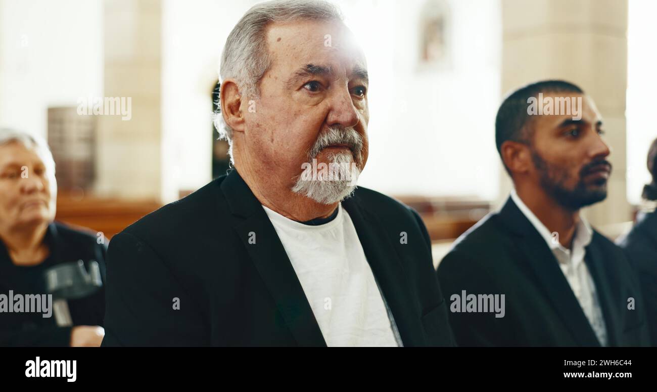Sad, senior man and closeup at a funeral in church for religious ...