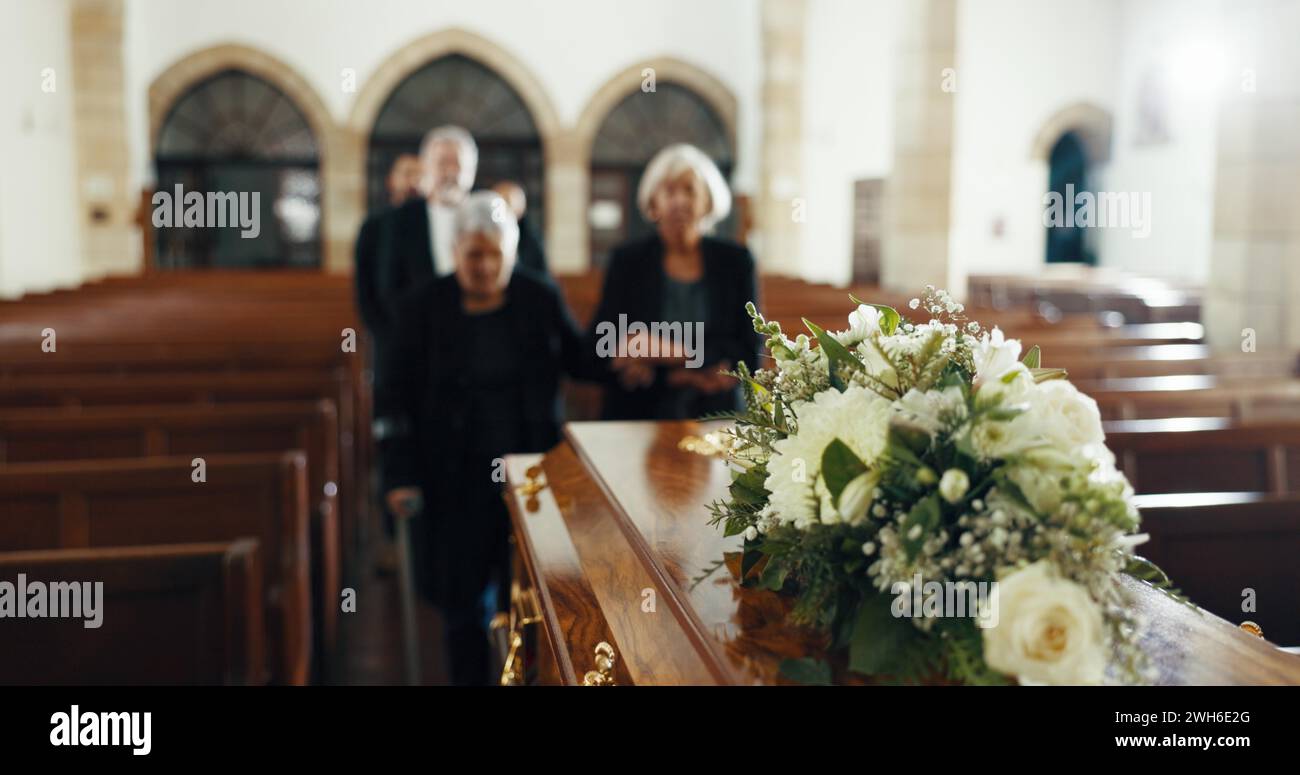 Funeral, church and people with coffin for goodbye, mourning and grief ...