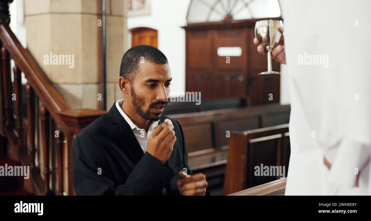 Religion, church and man with priest for communion for ceremony ...