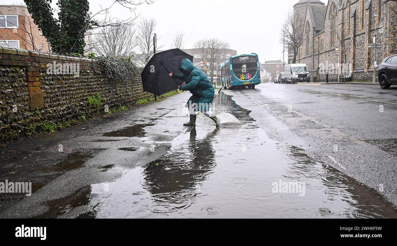 Coat across puddle hi-res stock photography and images - Alamy