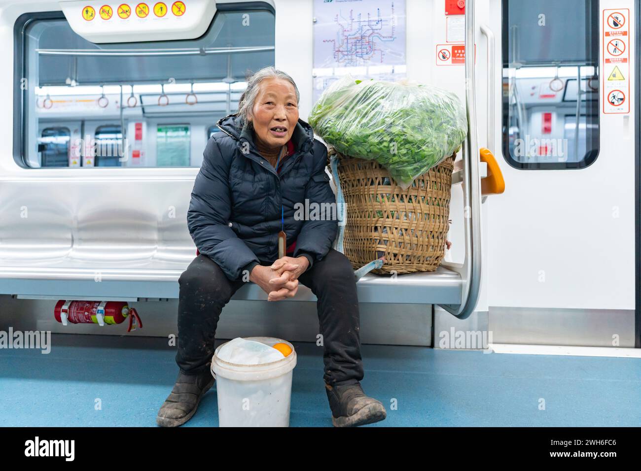 CHONGQING, CHINA - FEBRUARY 8, 2024 - Vegetable farmers carries baskets ...