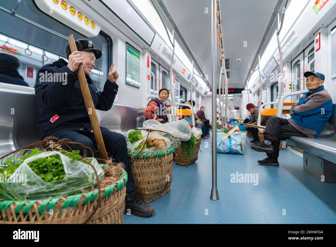CHONGQING, CHINA - FEBRUARY 8, 2024 - Vegetable farmers carries baskets ...