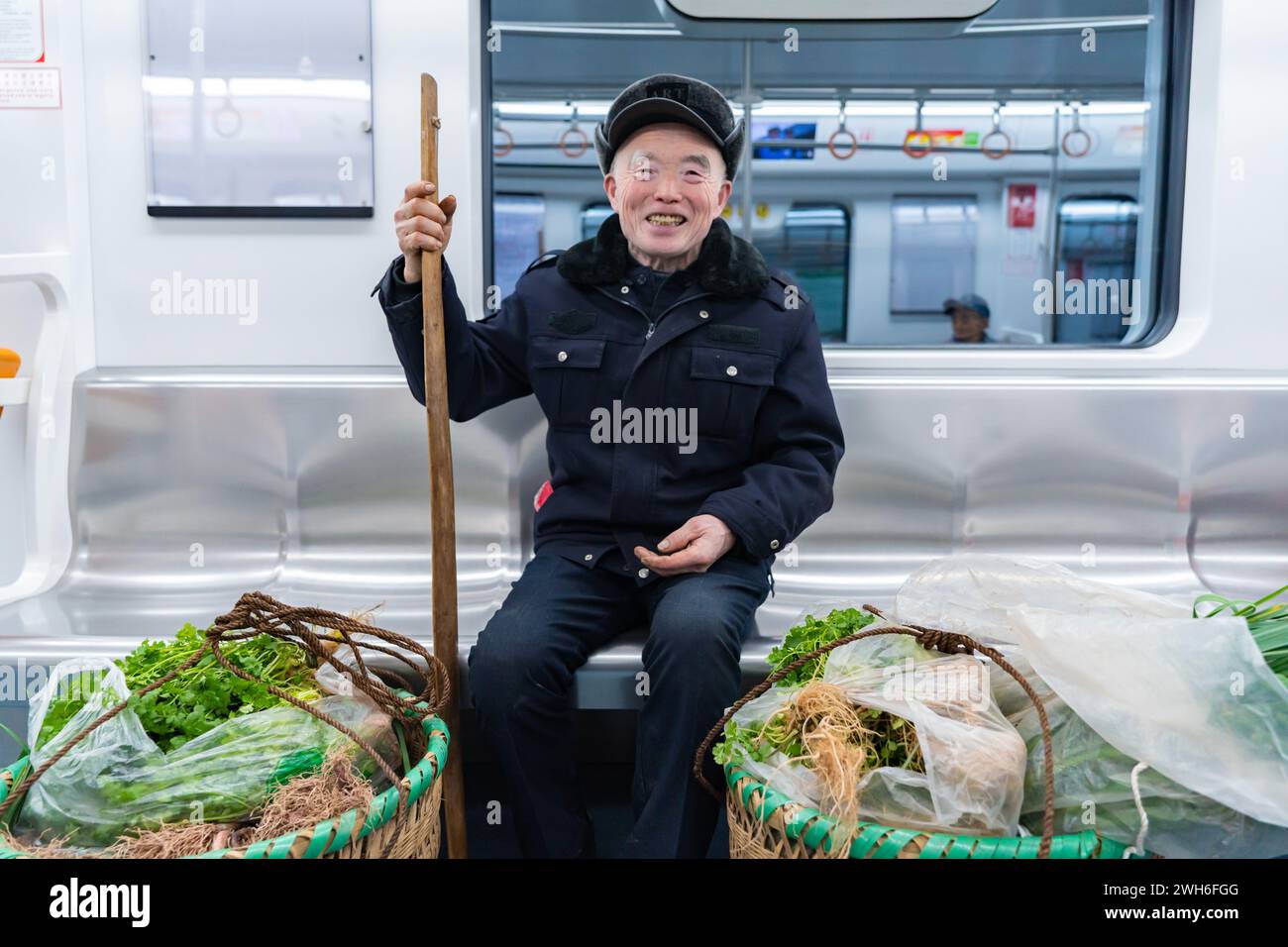 CHONGQING, CHINA - FEBRUARY 8, 2024 - Vegetable farmers carries baskets ...