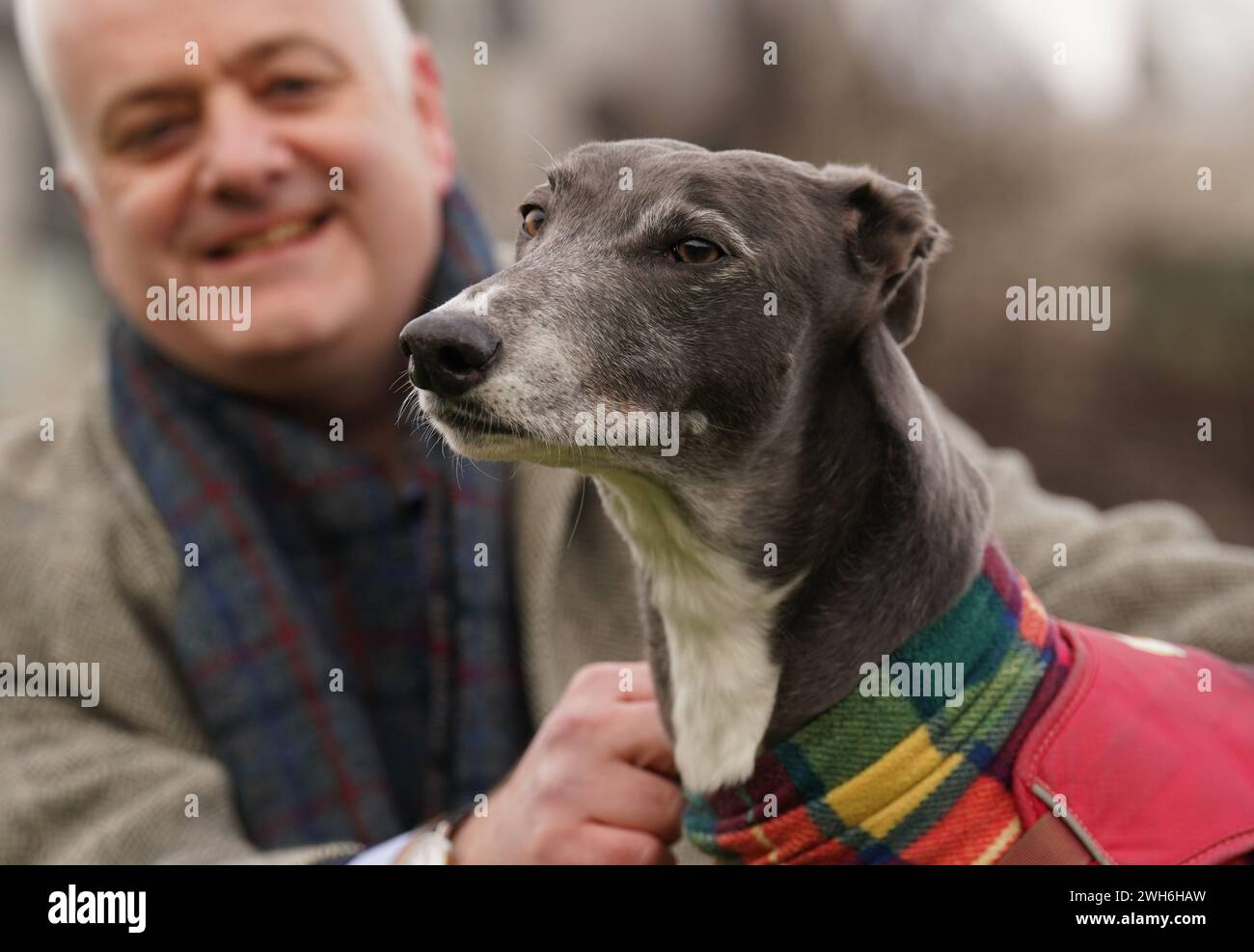 Scottish Green MSP Mark Ruskell stands with former greyhound racing dog ...