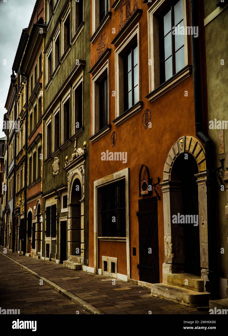 An ancient street amidst towering urban structures in a bustling ...