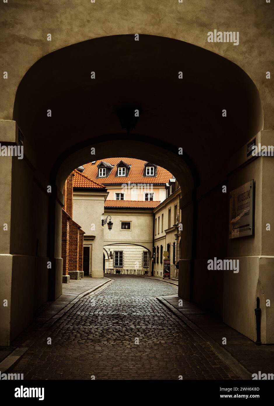 An architectural archway between two historical buildings in a charming ...