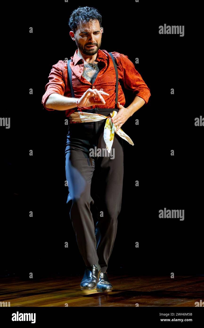 Male flamenco dancer with intense concentration performing elegant hand ...