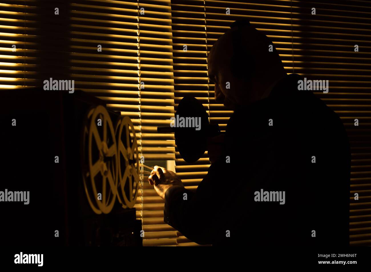 Secret agent secretly eavesdropping directional microphone pushing the ...